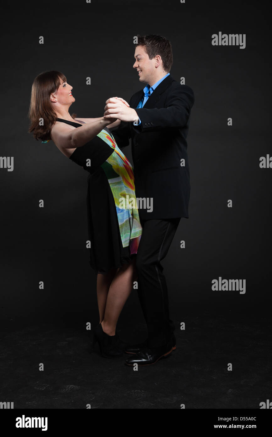 Romantic happy young couple dancing together. Stylish dressed Stock ...