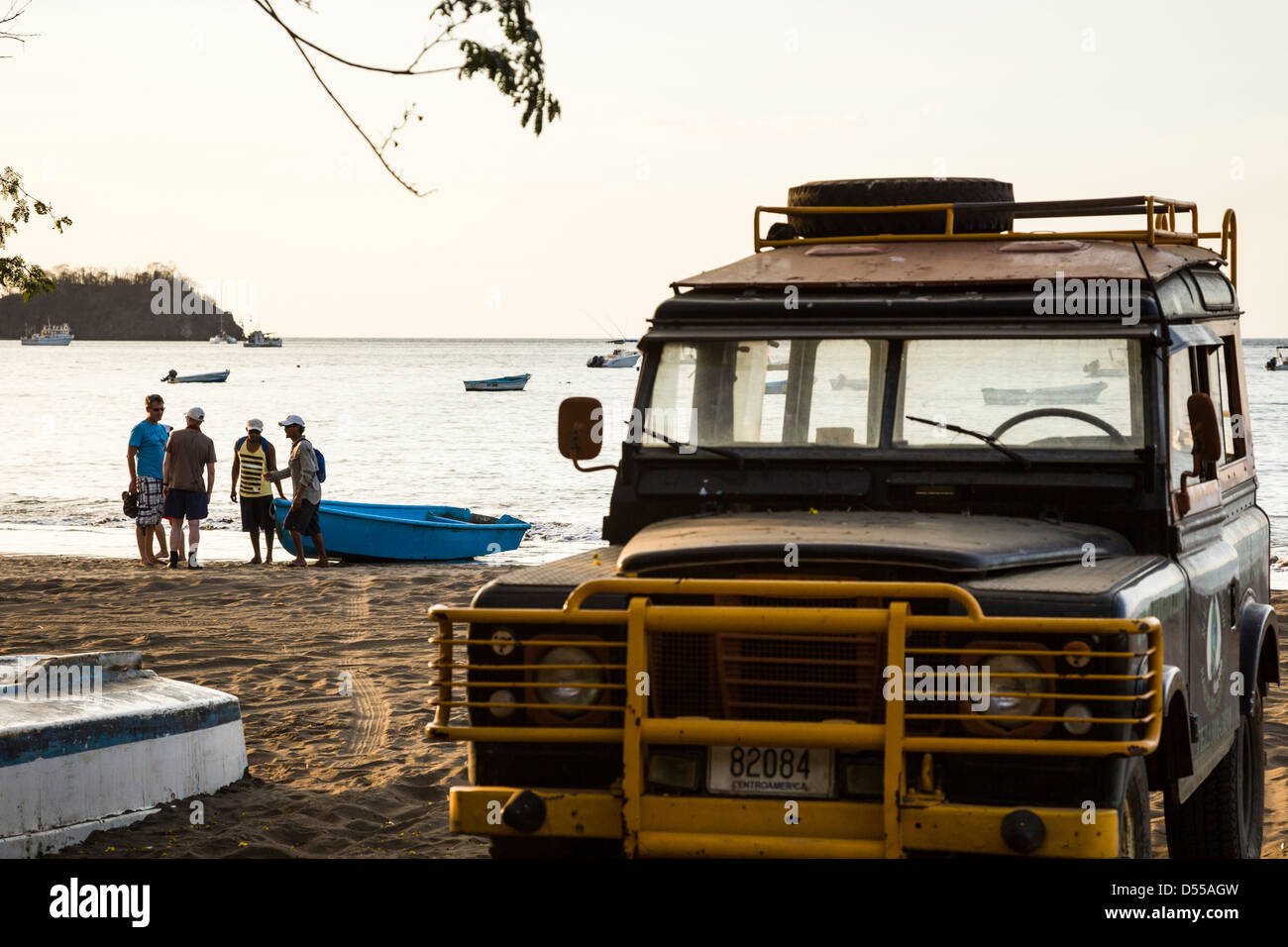 Vintage jeep parked on the beach at Playas del Coco, Guanacaste ...