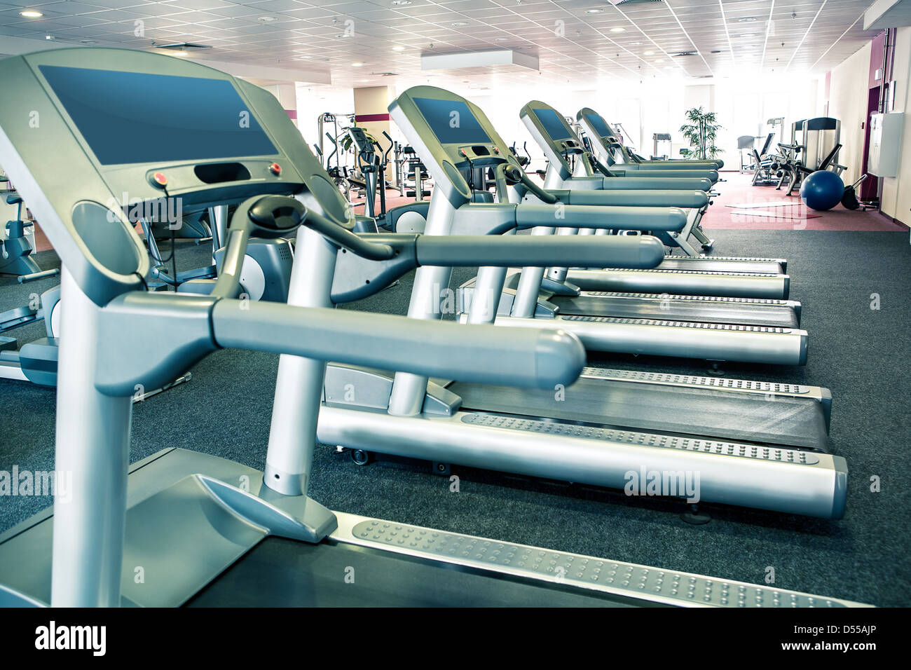 diverse equipment and machines at the gym room Stock Photo - Alamy
