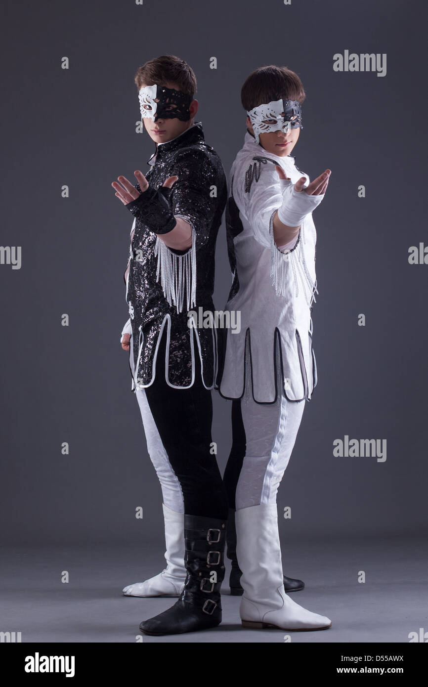Attractive men in masquerade costumes Stock Photo - Alamy