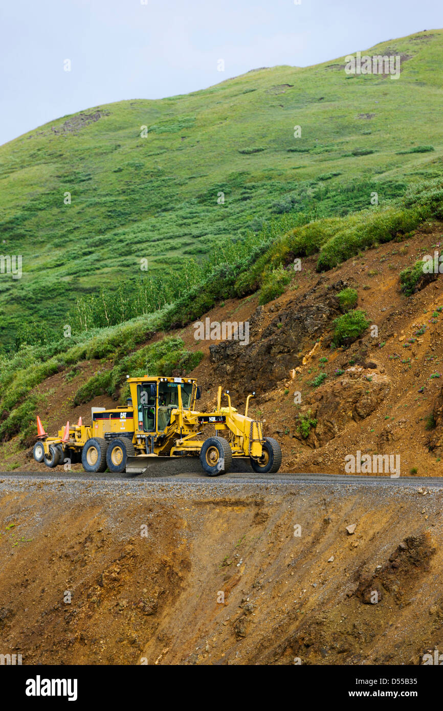 A heavy equipment road grader works on the Denali Park Road, Polychrome ...