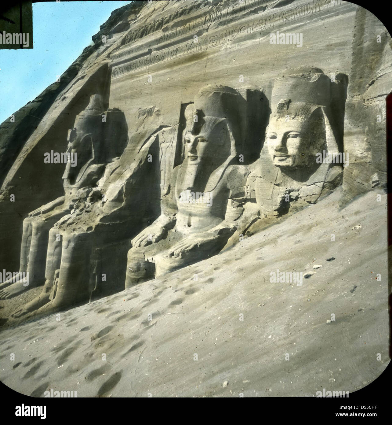 A hand-tinted photograph of the Abu Simbel temples in Egypt, featuring ...