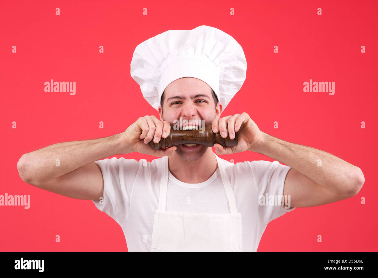 chef shot in red background Stock Photo - Alamy
