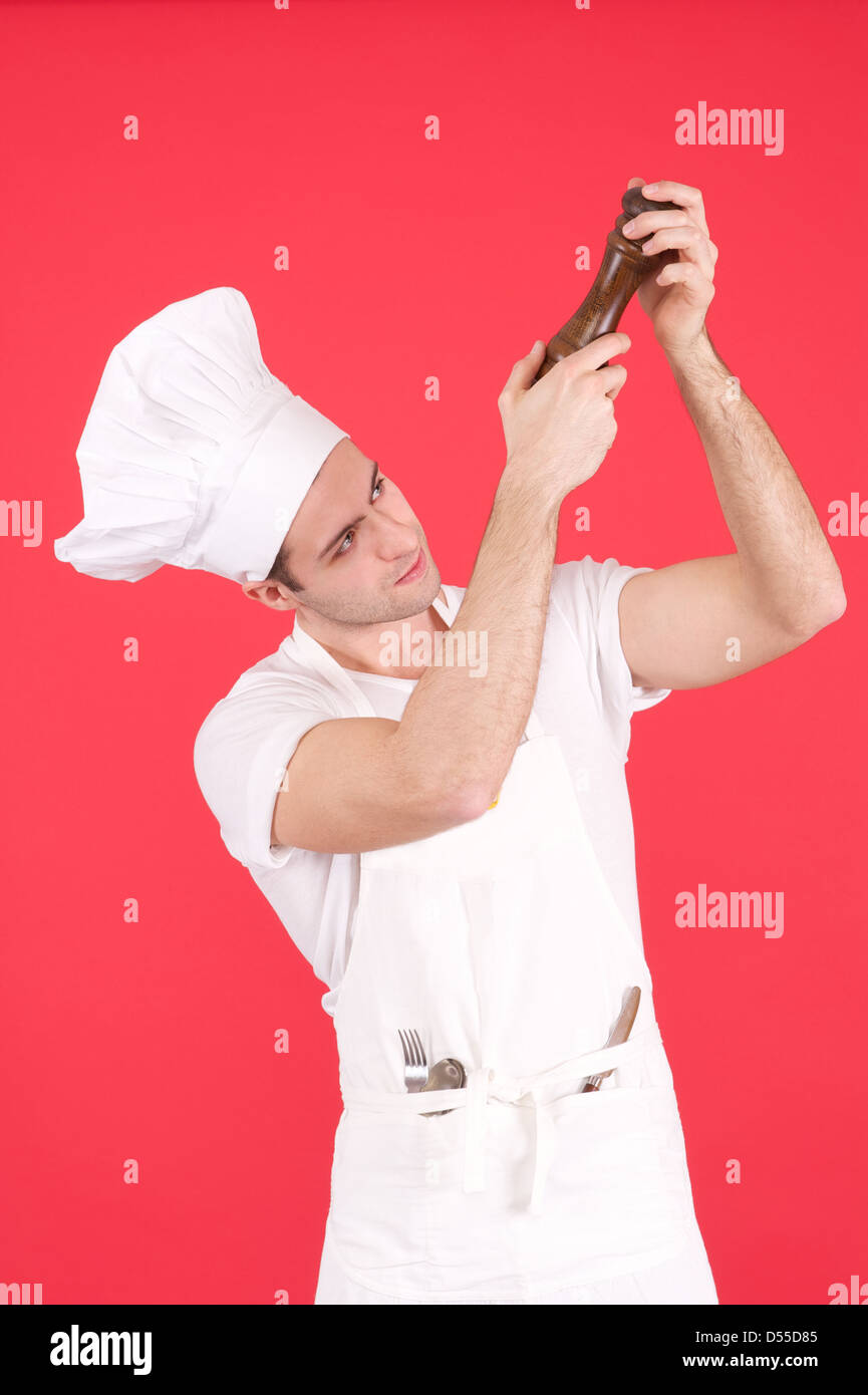chef shot in red background Stock Photo - Alamy