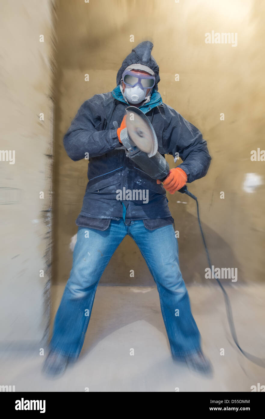 Crazy repairman with grinder Stock Photo - Alamy