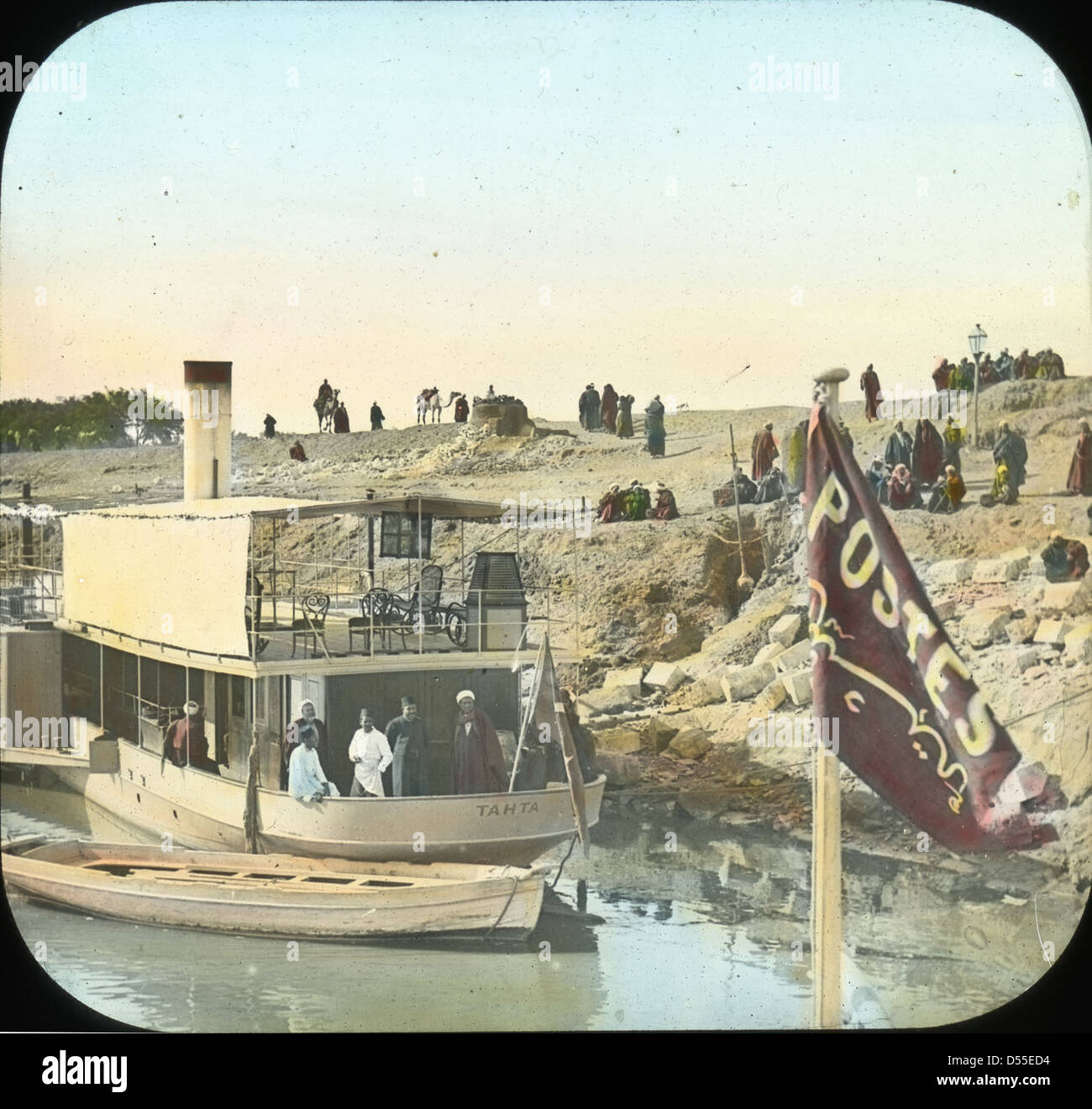 A hand-colored photograph depicting the arrival of a post boat at ...