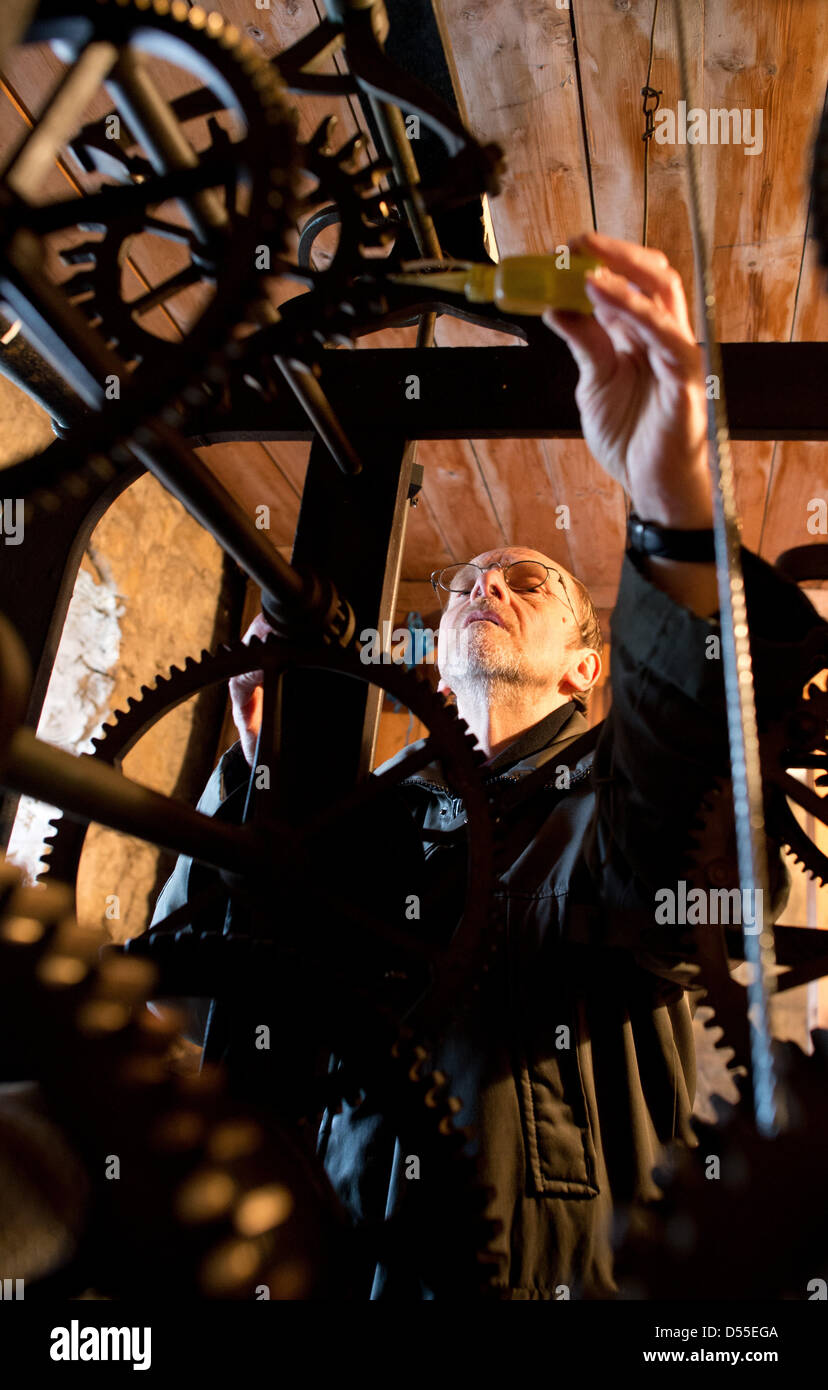 Master clockmaker Rolf Zurmoehle oils the gears of the steeple clock at ...