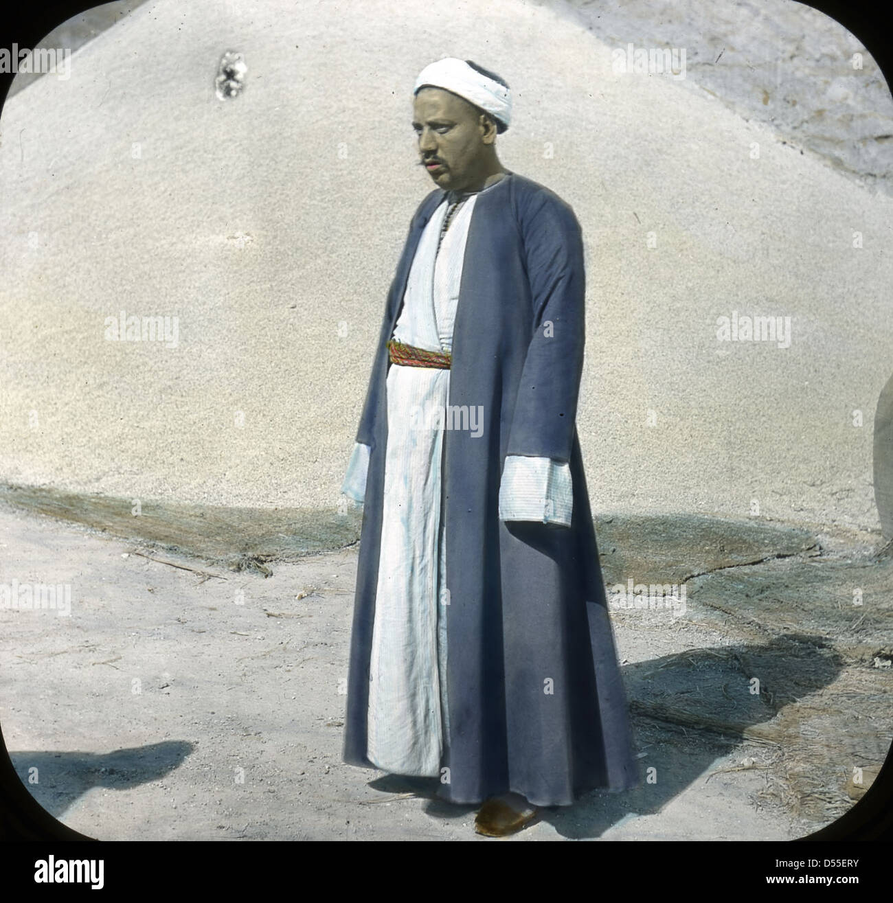 This photograph depicts a grain merchant in Cairo, Egypt, showing the ...