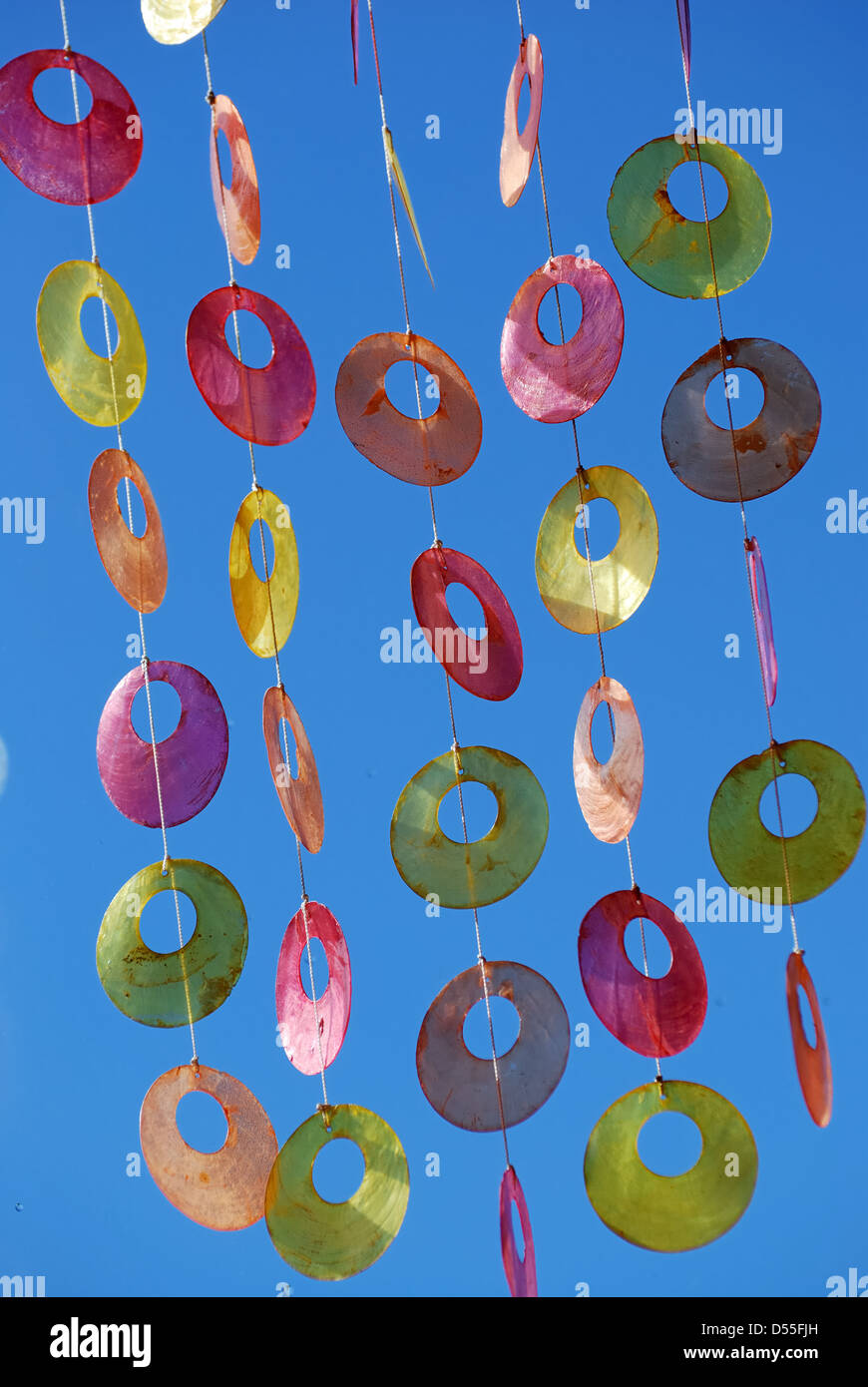 Funny window decoration with colored disks Stock Photo - Alamy