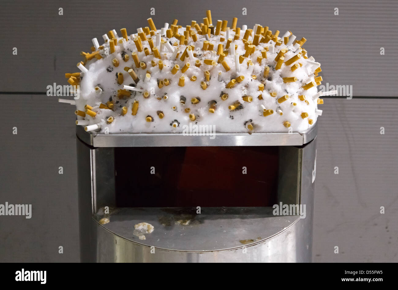 Berlin, Germany, cigarette stuck in the snow cover of a trash can Stock ...