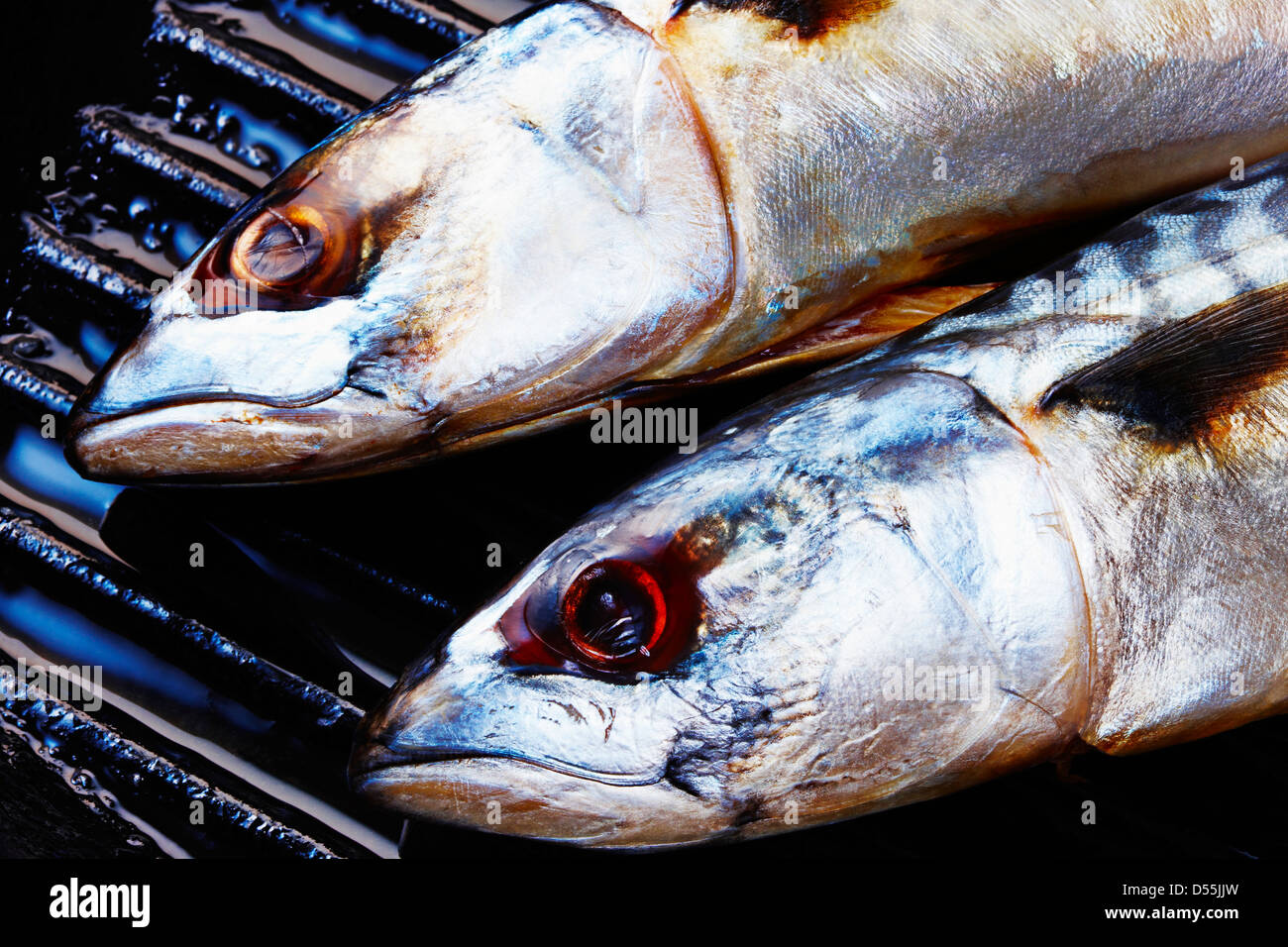 Two Mackerel on a griddle Stock Photo - Alamy