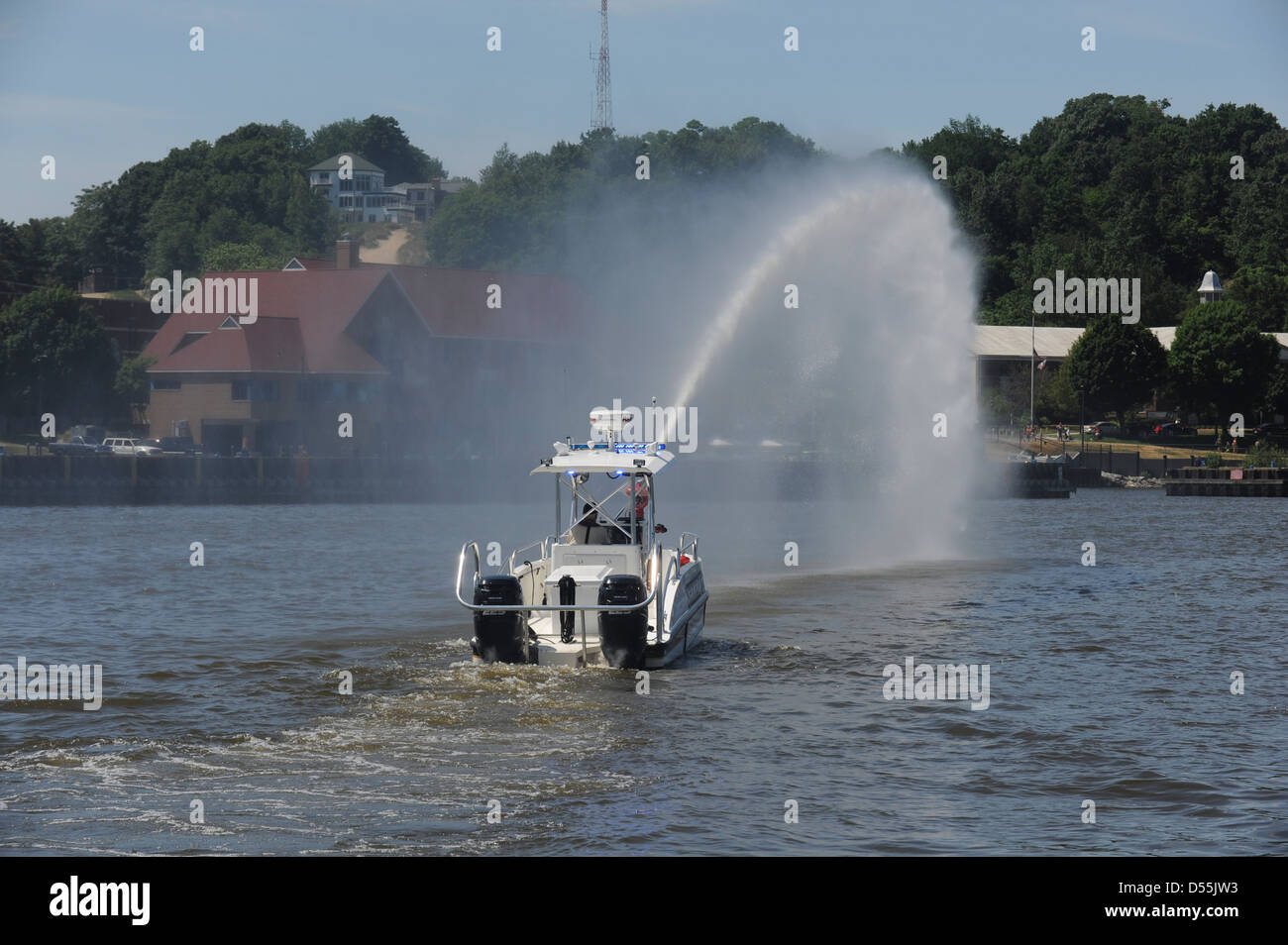 Police fire/rescue boat pumping water Stock Photo - Alamy