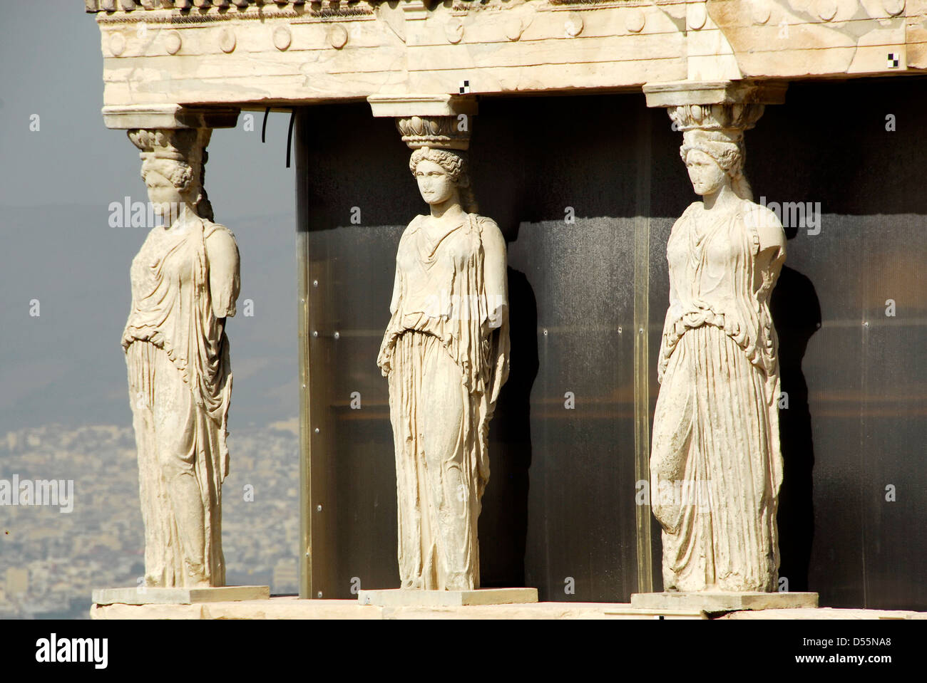 The ruins of Erechtheion with statues of Caryatids on Acropolis in ...