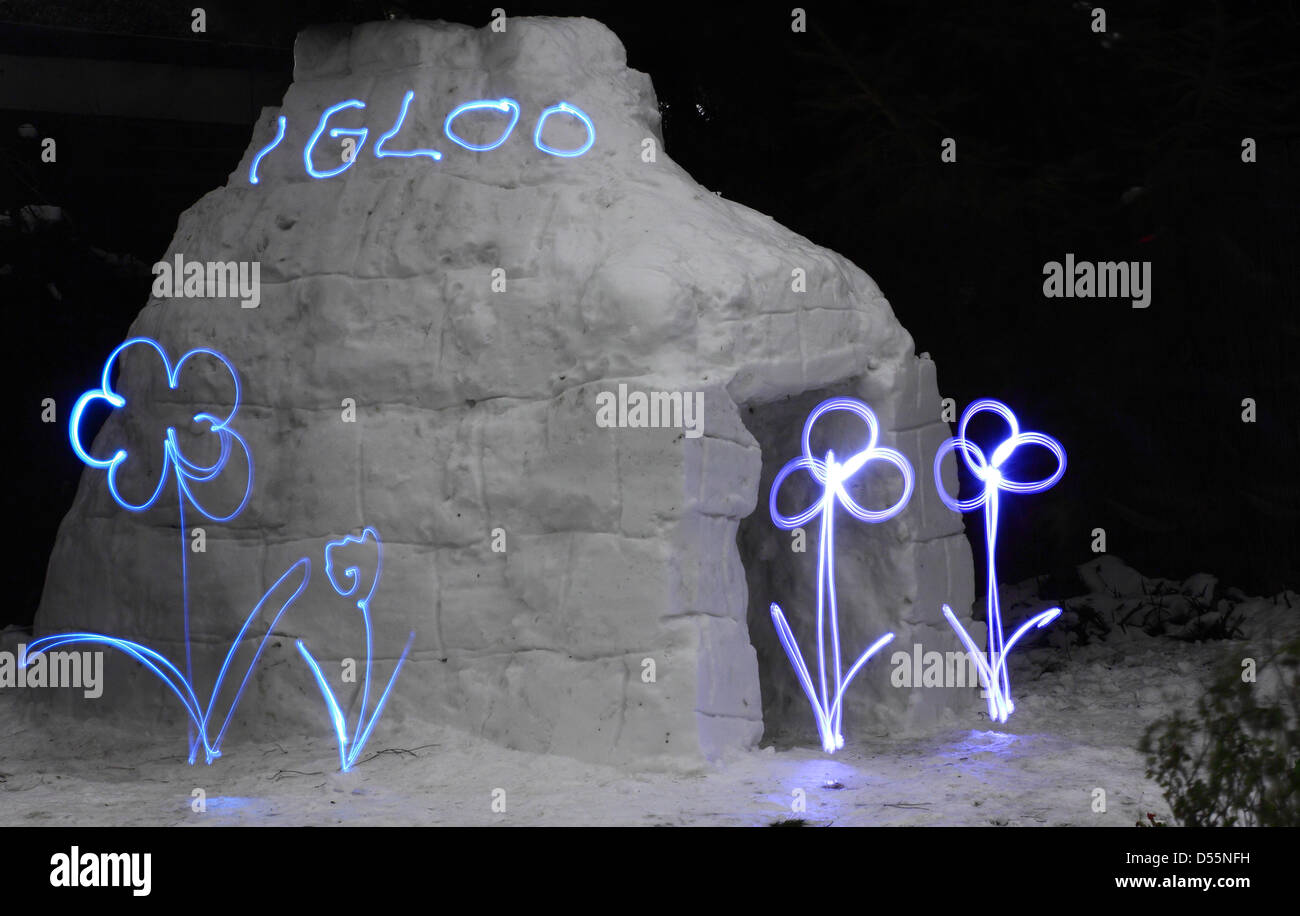 Igloo with torch painted flowers and igloo wording Stock Photo - Alamy