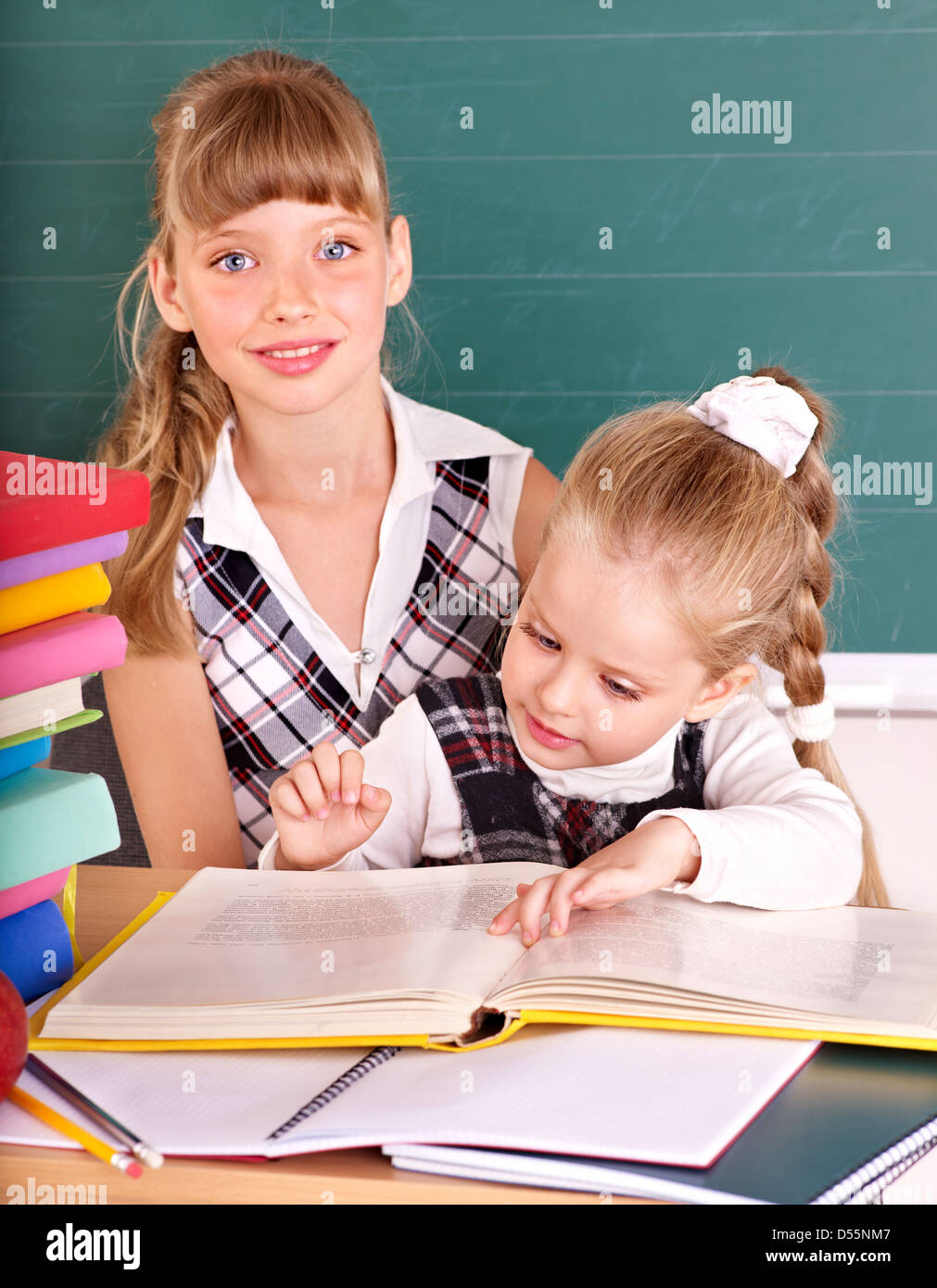 Schoolchild in classroom near blackboard Stock Photo - Alamy