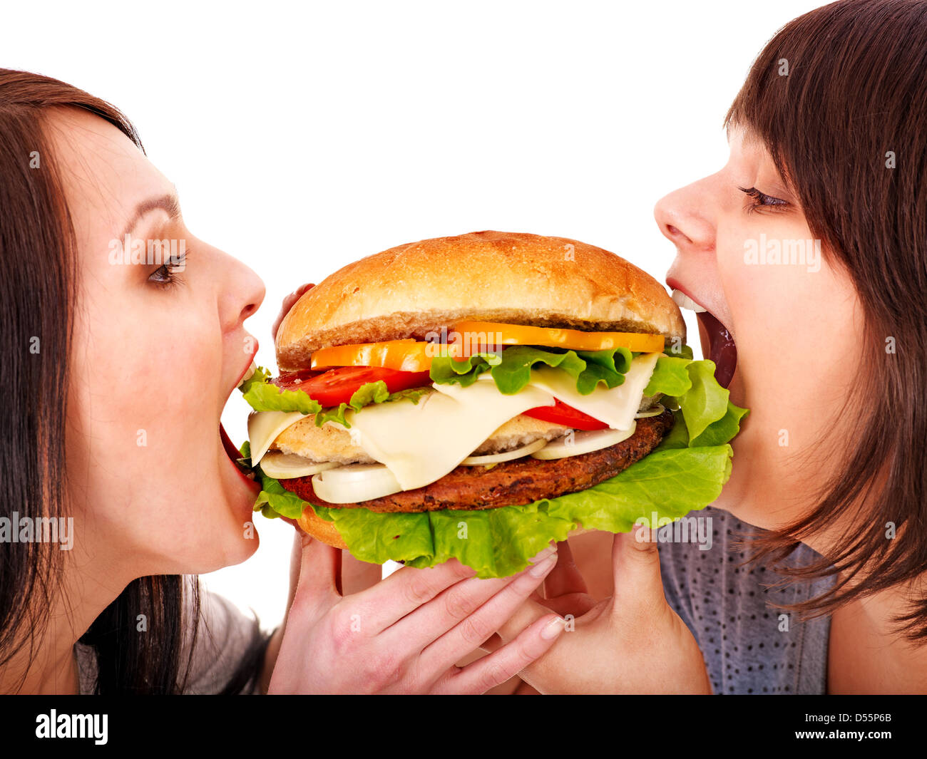 Women eating hamburger Stock Photo - Alamy