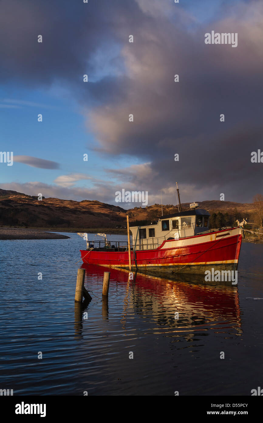 Red hulled fishing boat moored in the Sound of Sleat, Glenelg, Scottish ...