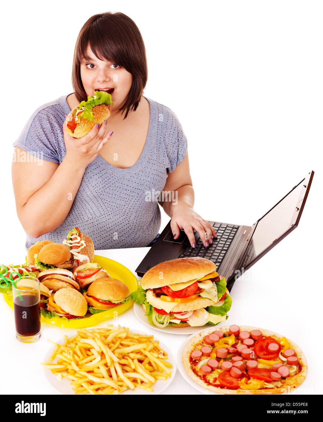 Woman eating fast food at work. Isolated Stock Photo - Alamy
