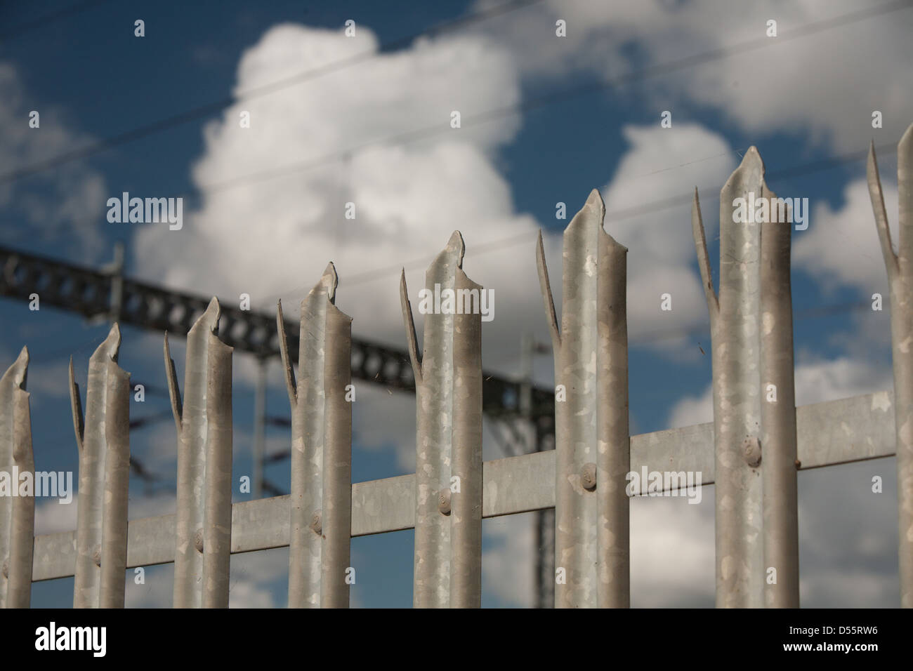 Detail of spiked security fence alongside a railway line Stock Photo ...