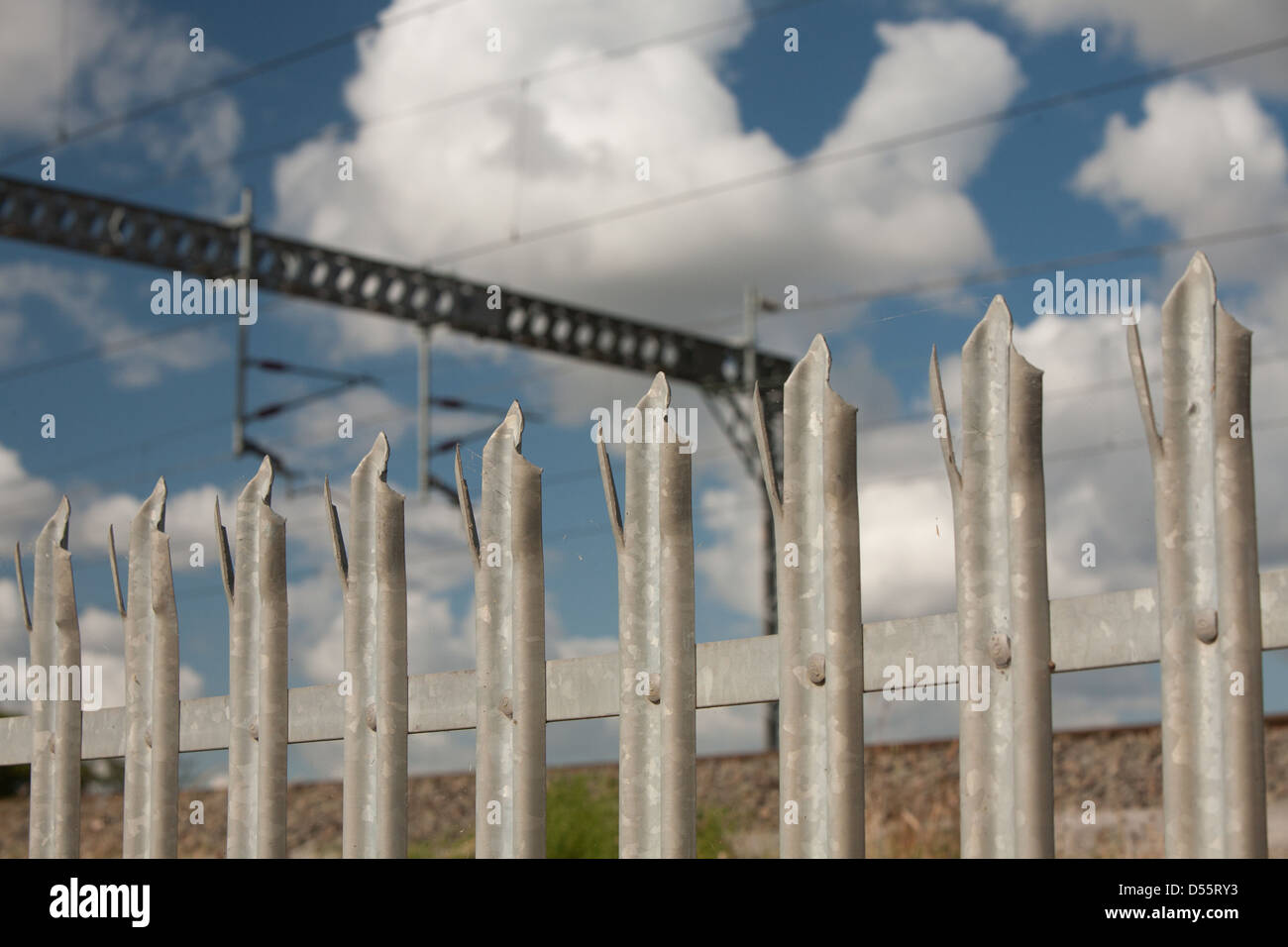 Detail of spiked security fence alongside a railway line Stock Photo ...