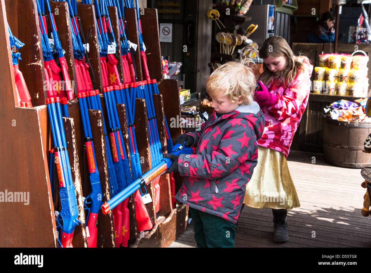 Children playing with Toy Guns in a shop Stock Photo - Alamy