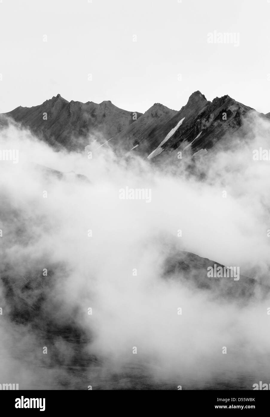 Black and white view of low clouds, mist and fog partially obscure the ...