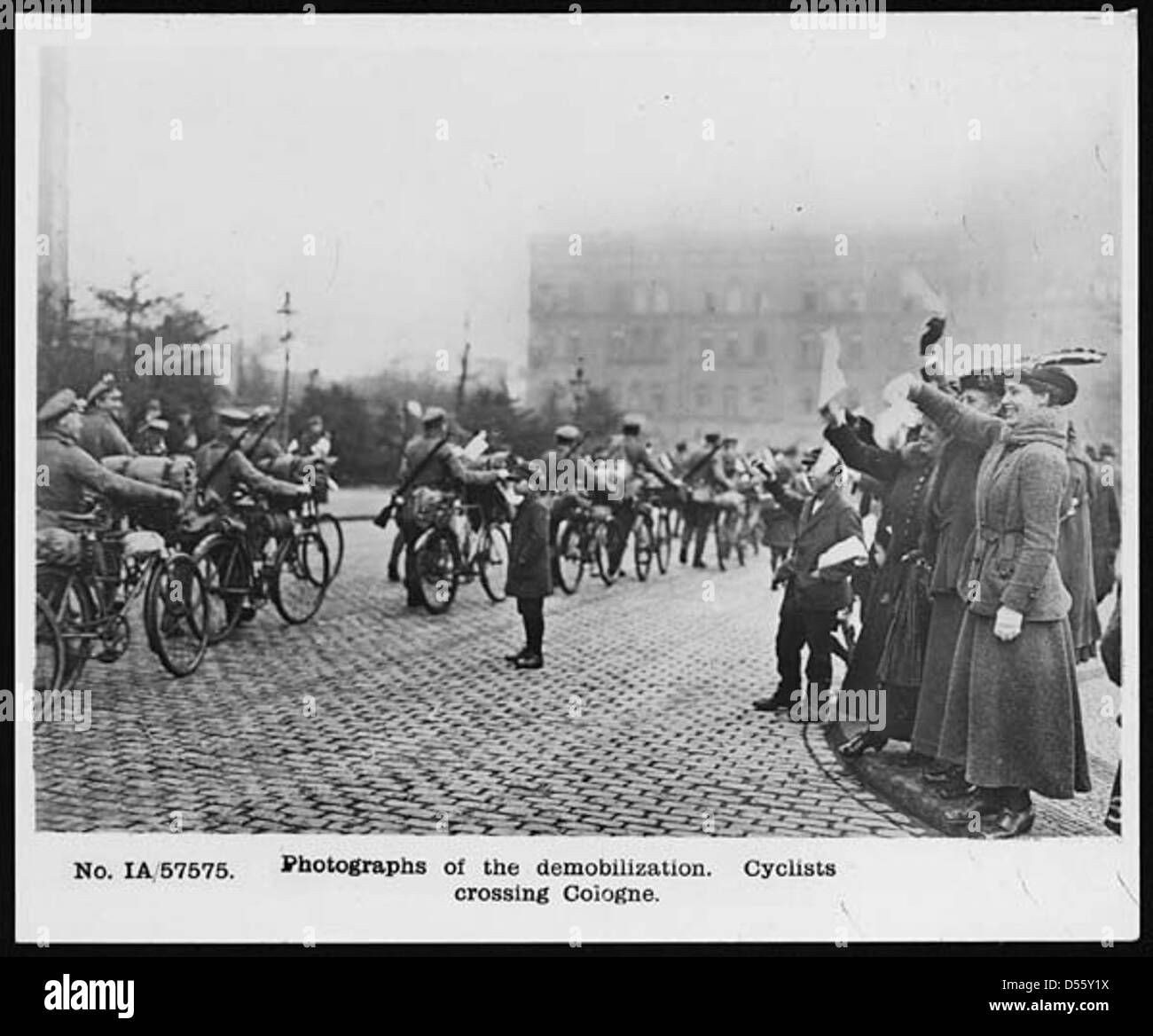 Cyclists passing through Cologne during World War I, showcasing ...
