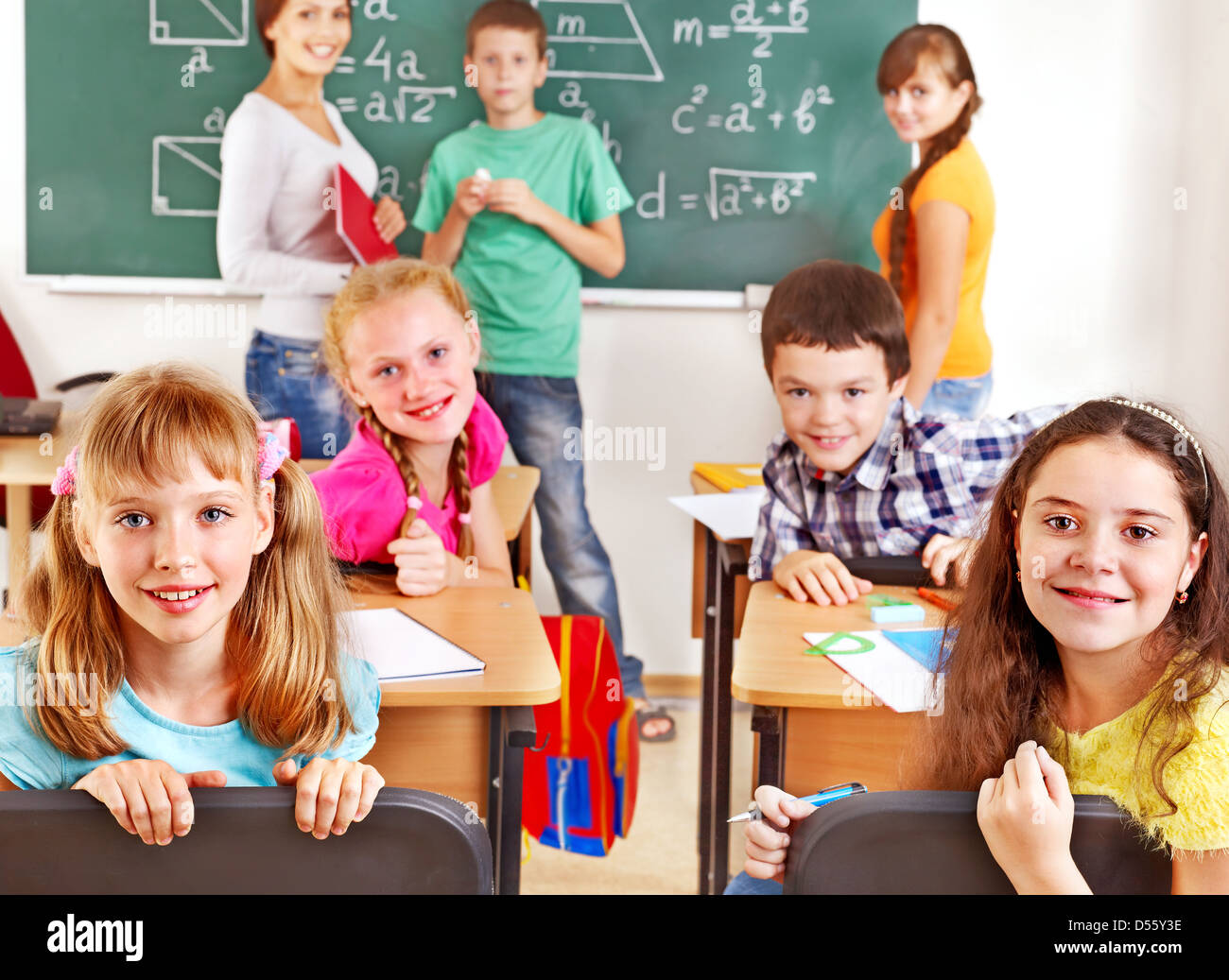 School child with teacher on lesson Stock Photo - Alamy