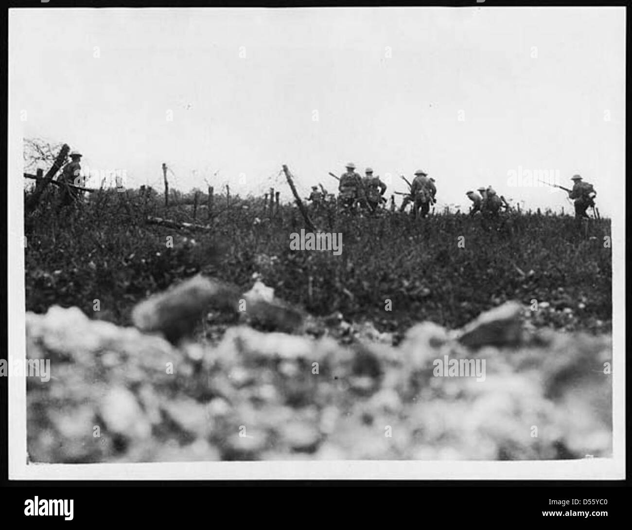 Soldiers from the Wiltshire Regiment advancing across a battlefield ...