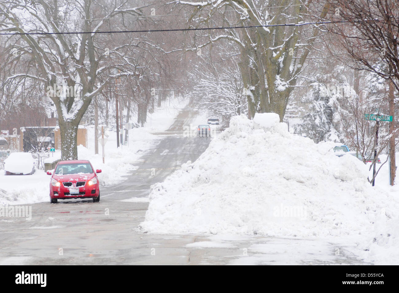 A winter snowstorm leaves a foot of snow on a small Illinois town and ...