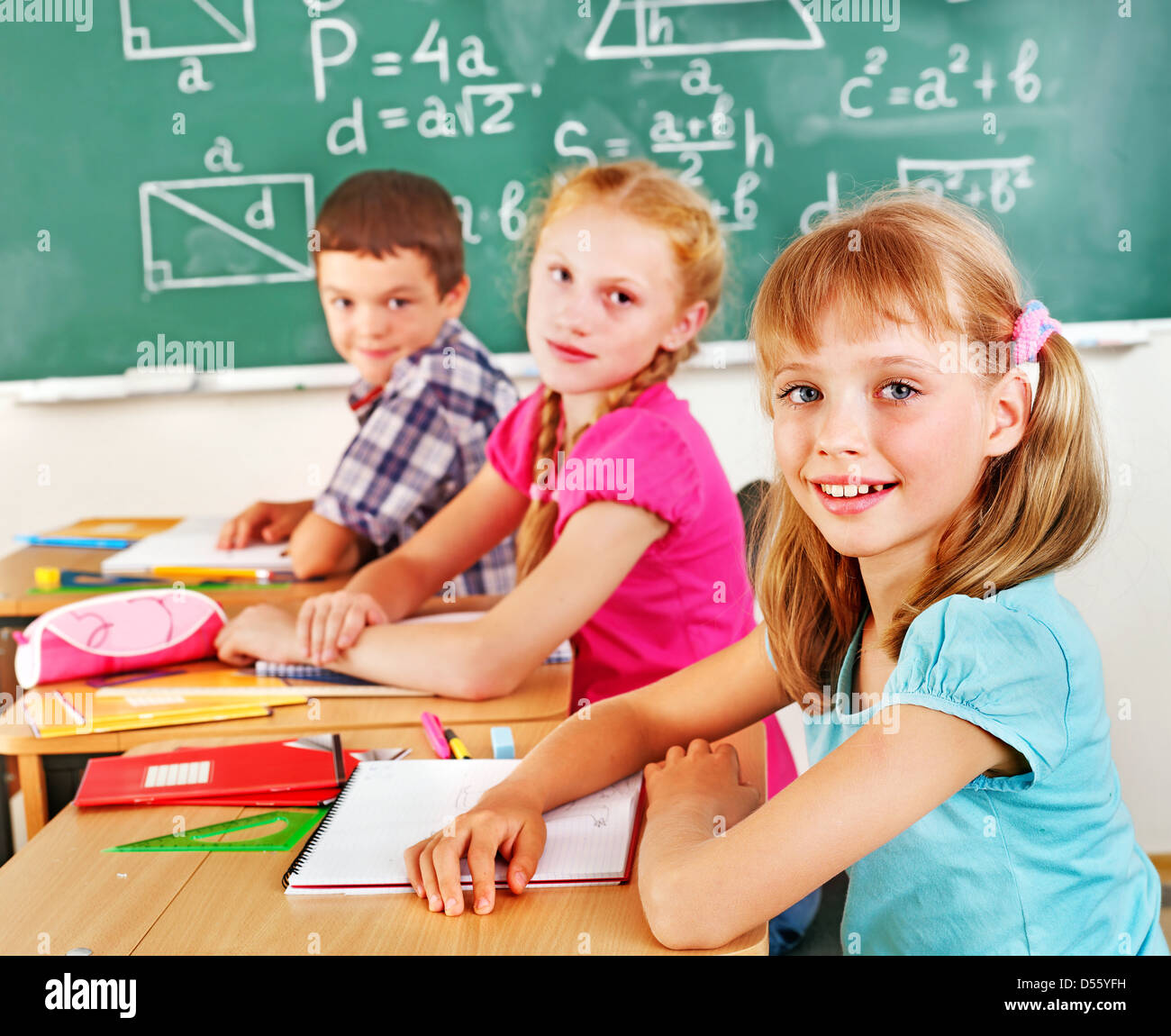 Group of school child sitting in classroom Stock Photo - Alamy
