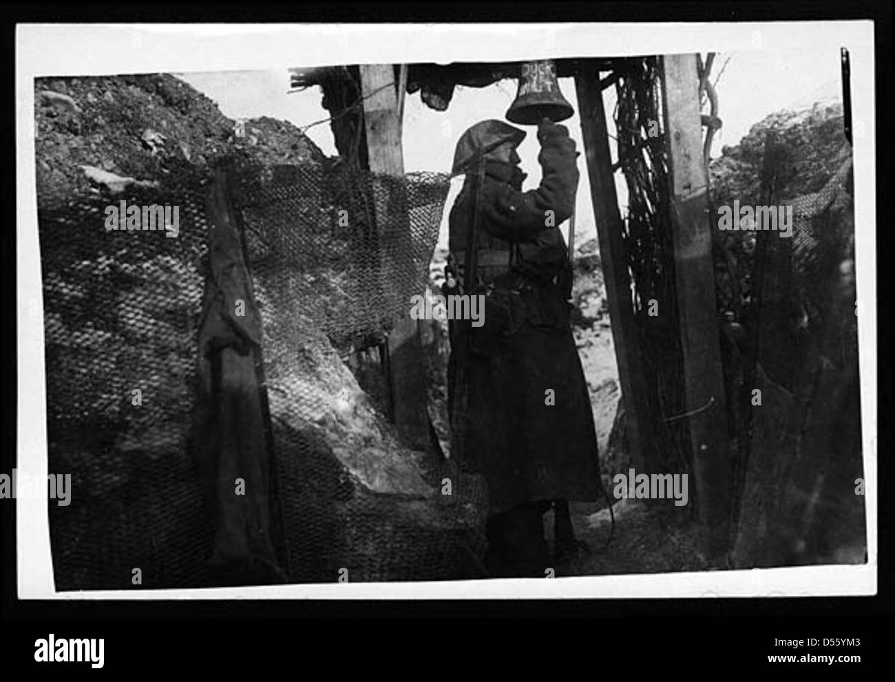 A gas alarm sounds on the front lines during World War I, signaling the ...