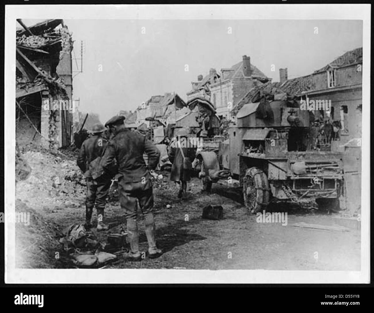 Armoured cars advancing on a road during World War I, showcasing their ...