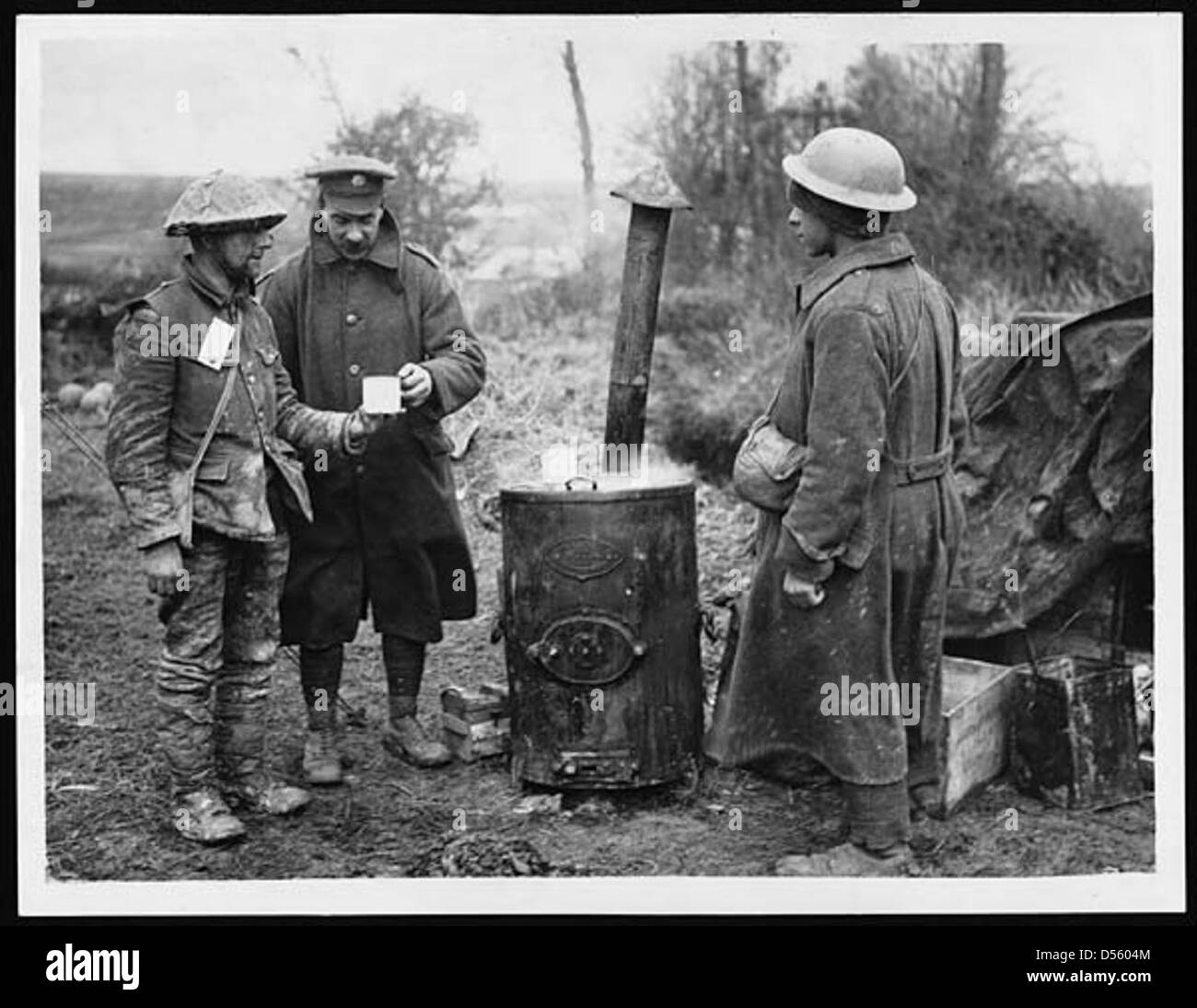 A soldier serves a cup of coffee to a wounded comrade, symbolizing the ...