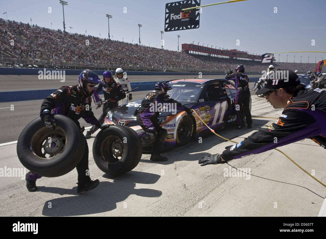Fontana, California, USA. 24th March 2013. Denny Hamlin's pit crew in ...