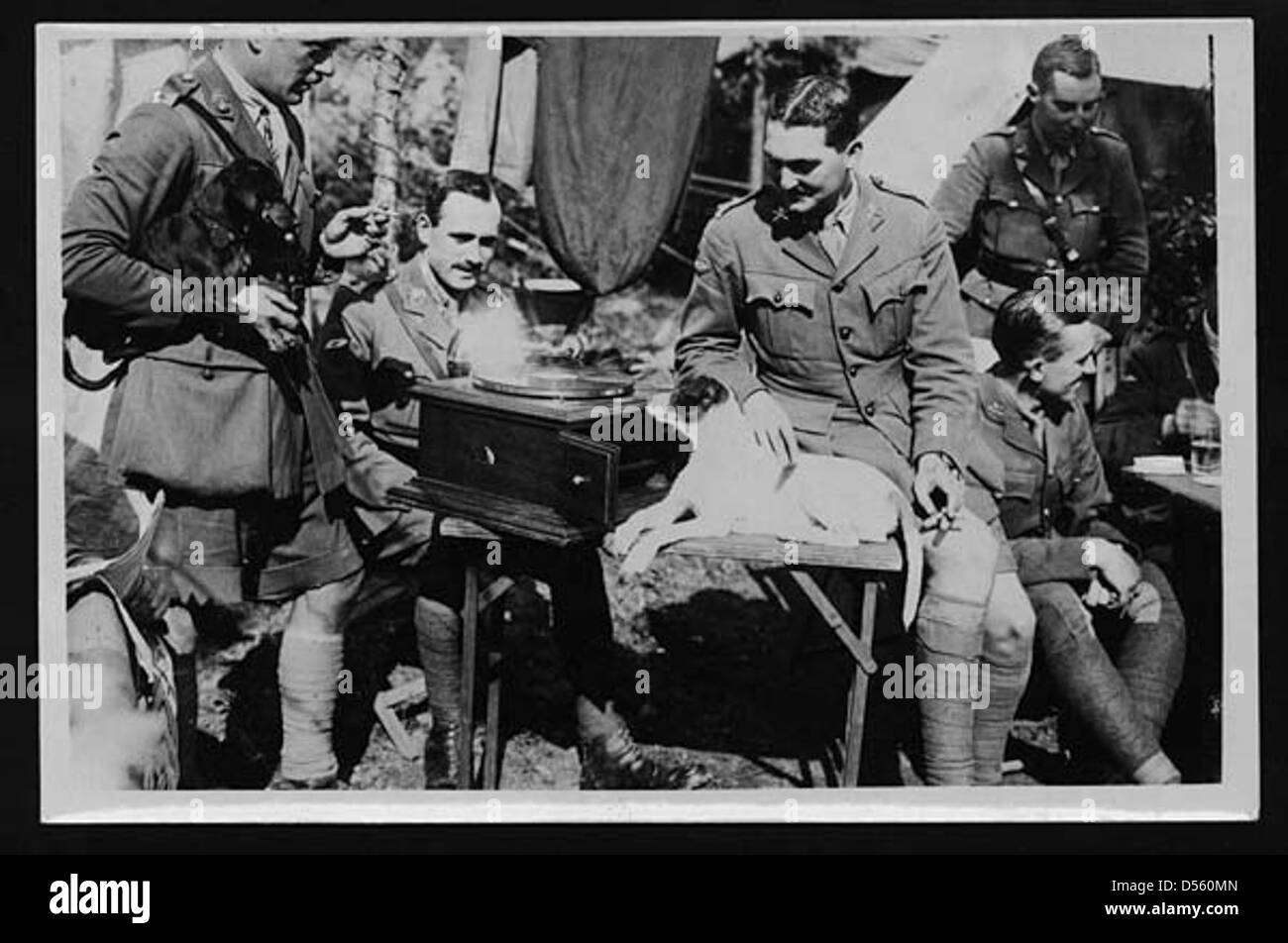 Soldiers during World War One are shown listening to a gramophone ...