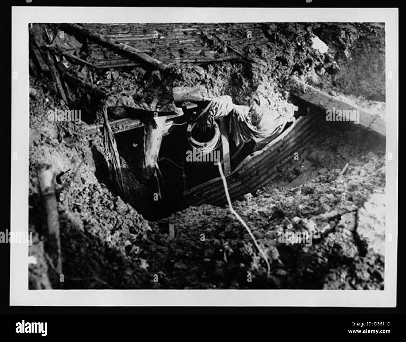 A captured German gun position is shown beneath the ground during World ...