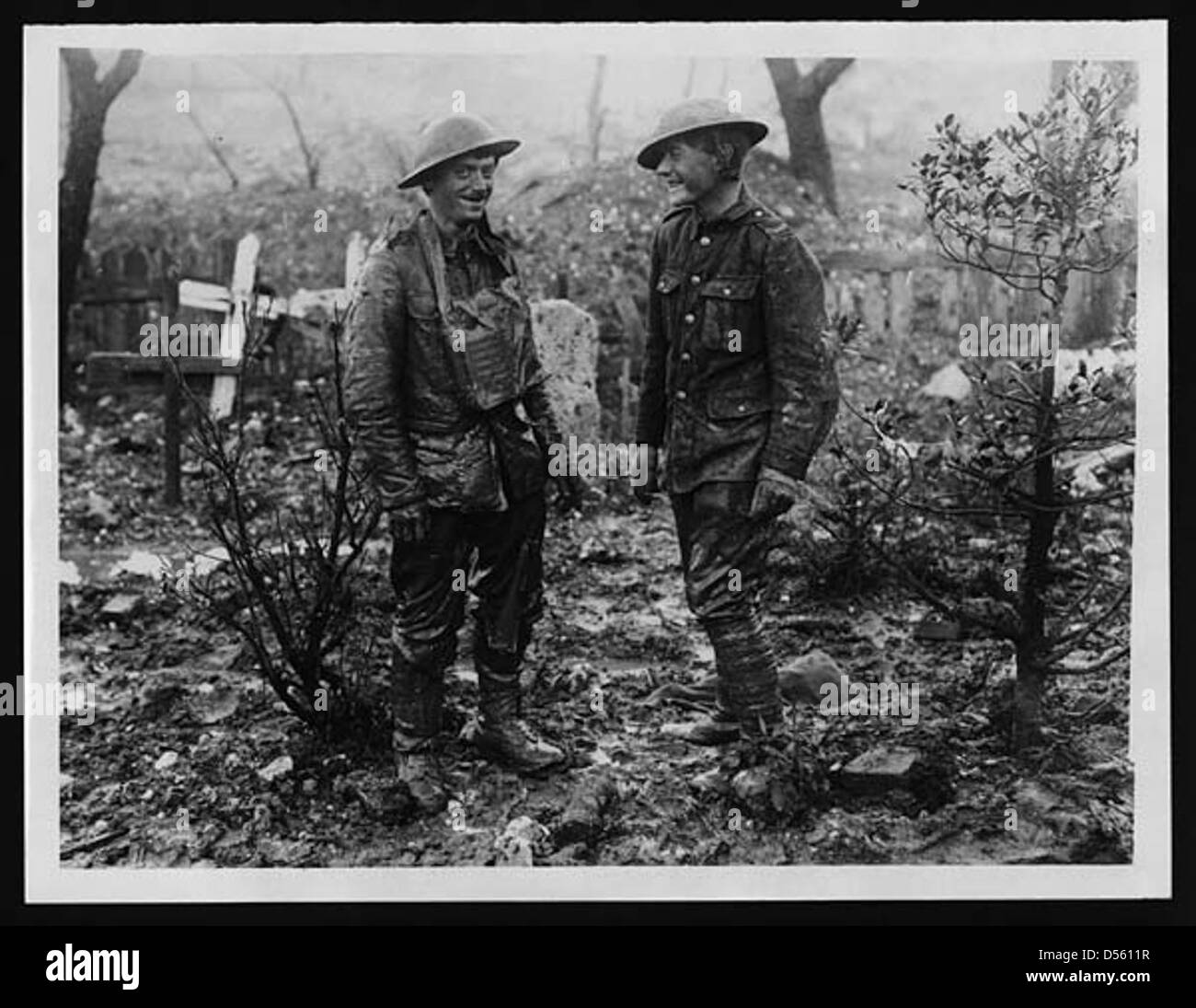 A soldier, rescued from deep mud where he had become trapped up to his ...