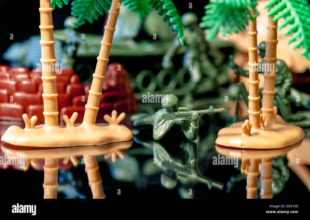 Toy Army Man protects base with Assault rifle Stock Photo - Alamy