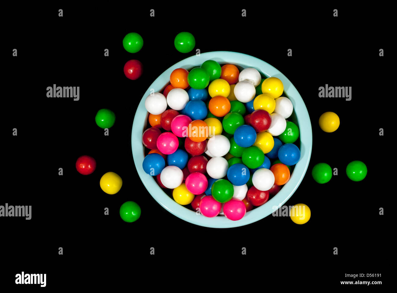 Gum balls overflowing from a bowl Stock Photo - Alamy