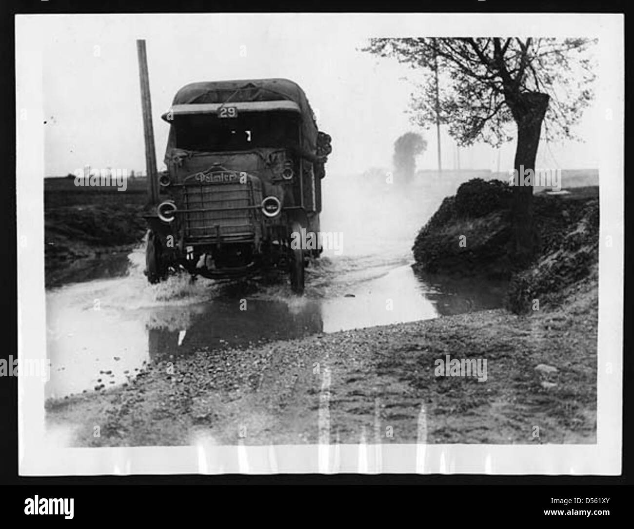 Soldiers travel along a road during World War I, moving toward the ...
