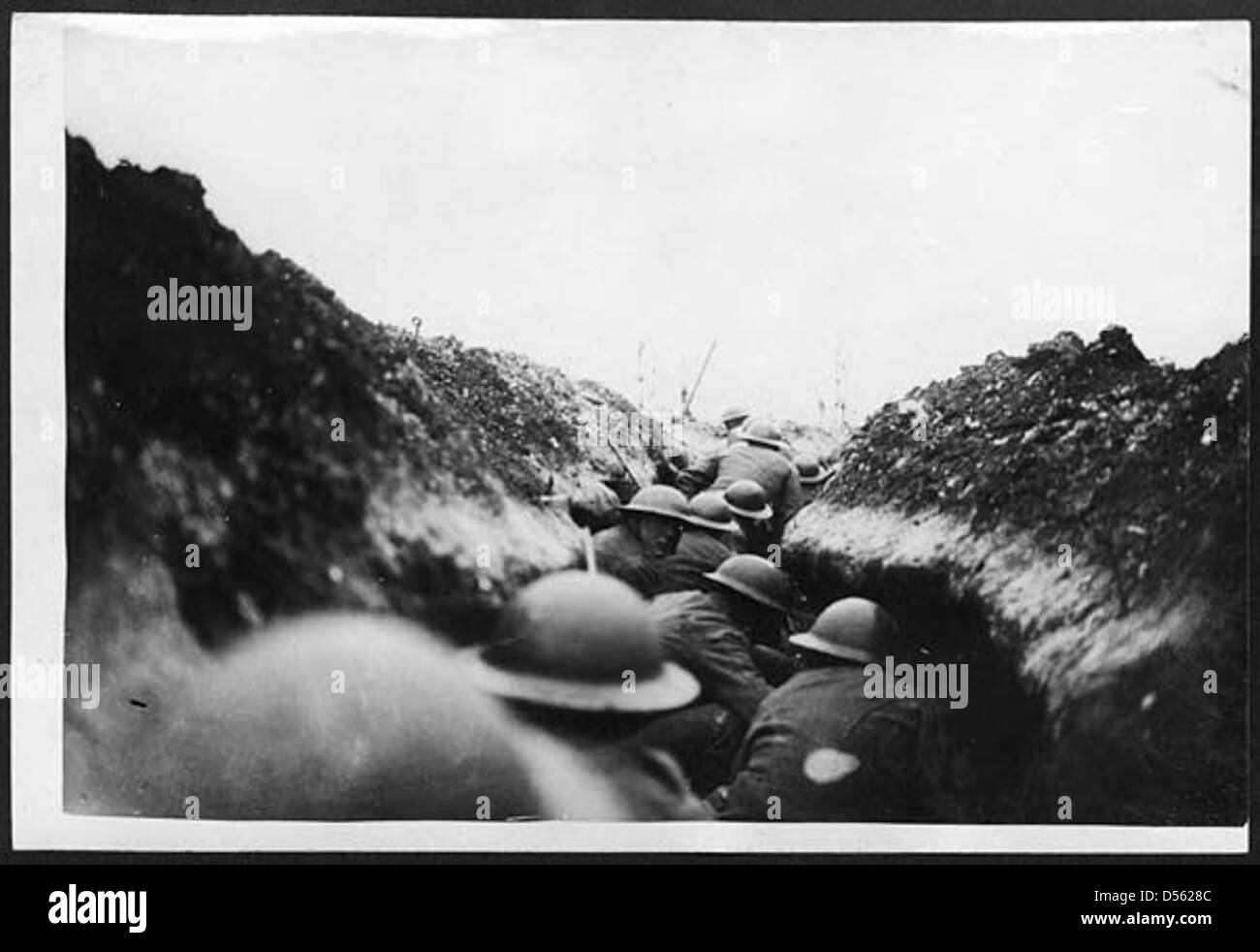 Infantry soldiers wait in position before launching an attack during ...