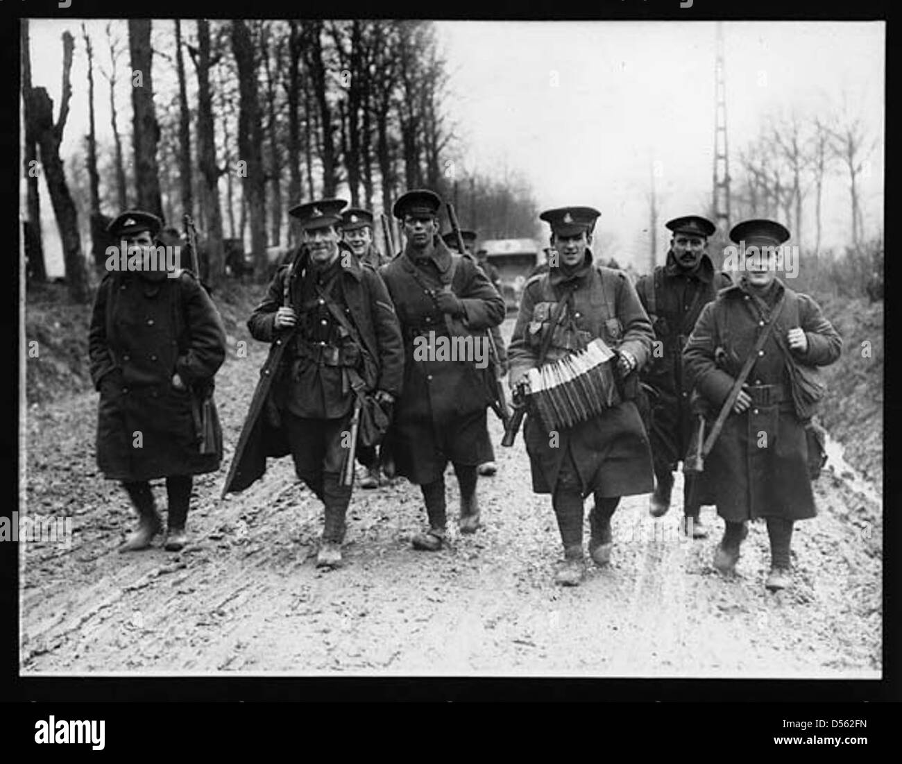 A group of soldiers returns from leave, approaching the location where ...