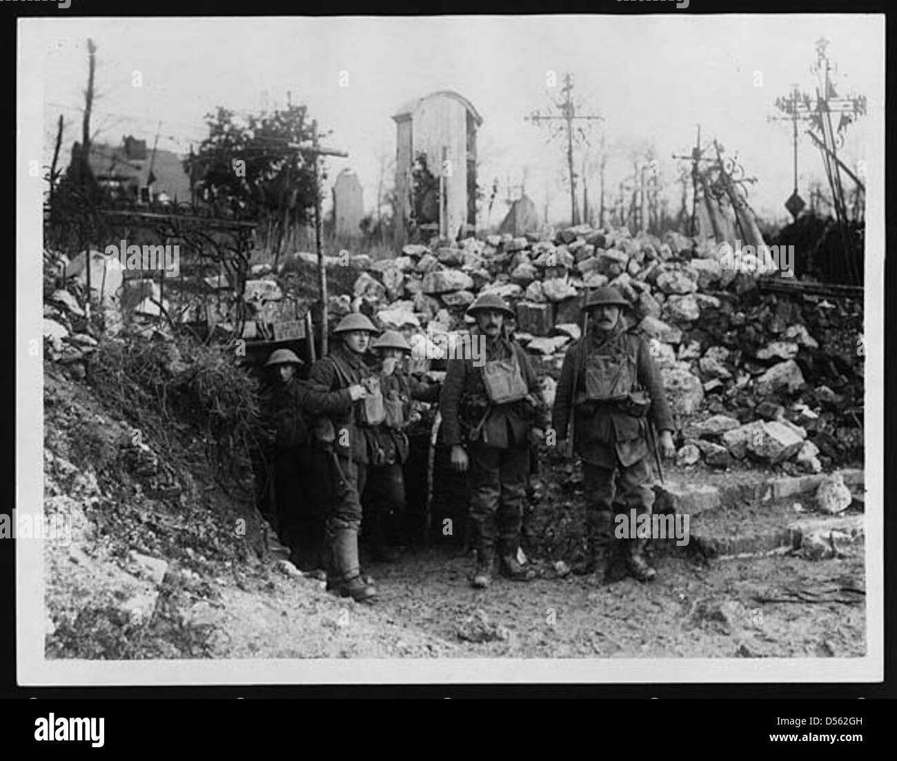 A soldier takes shelter in a dugout located under a churchyard during ...