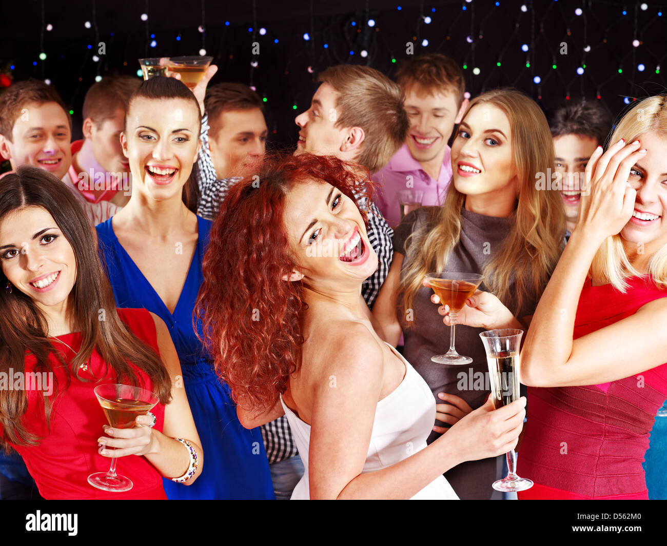 Group people with champagne dancing at party Stock Photo - Alamy