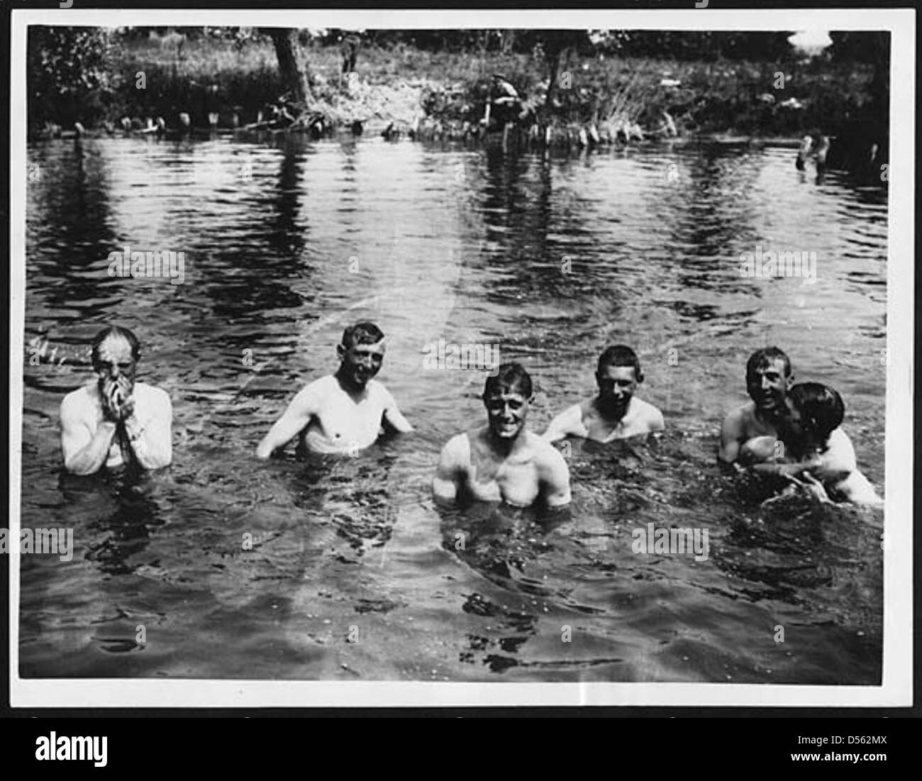 British soldiers, referred to as 'Tommies', take a bath in a pond on a ...