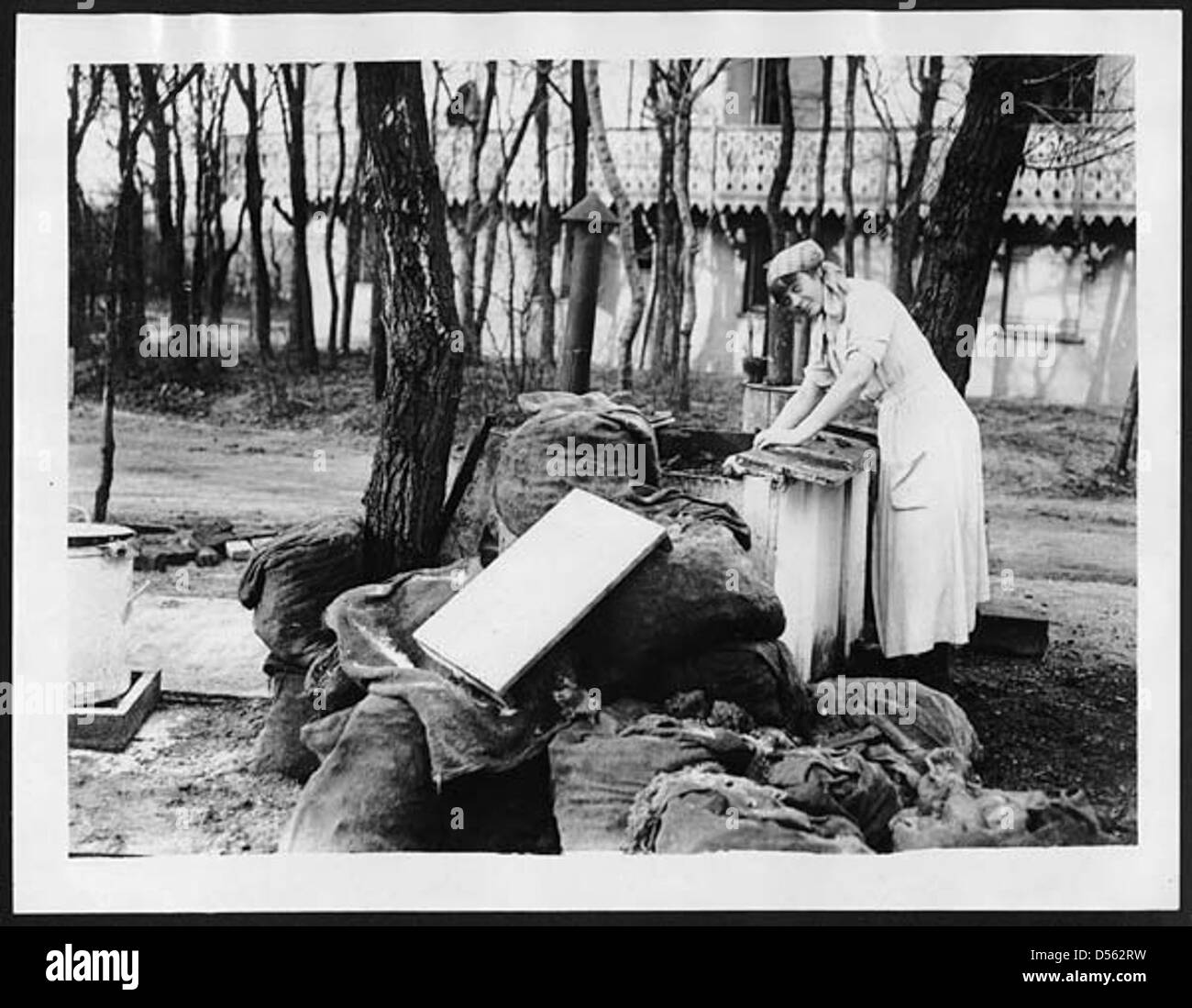A cook from the First Aid Nursing Yeomanry (FANY) gathers coal for her ...