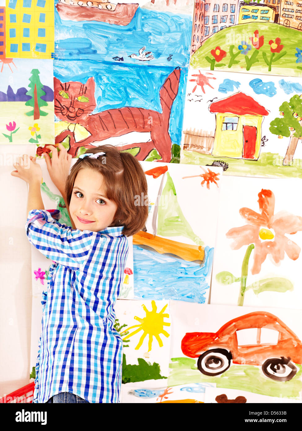 Little girl painting at school Stock Photo - Alamy