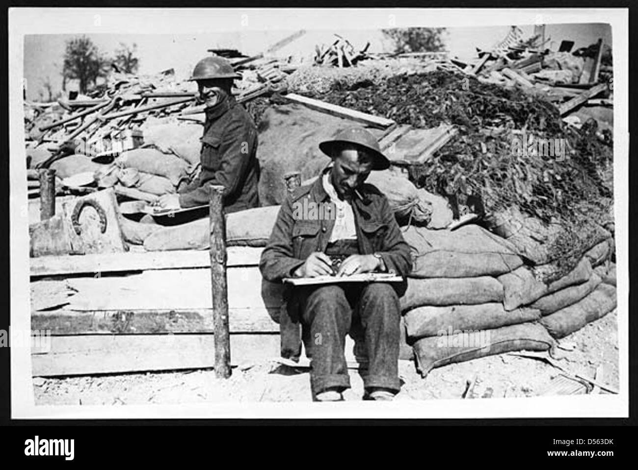A gunner writes a letter home during World War I, an act that provided ...