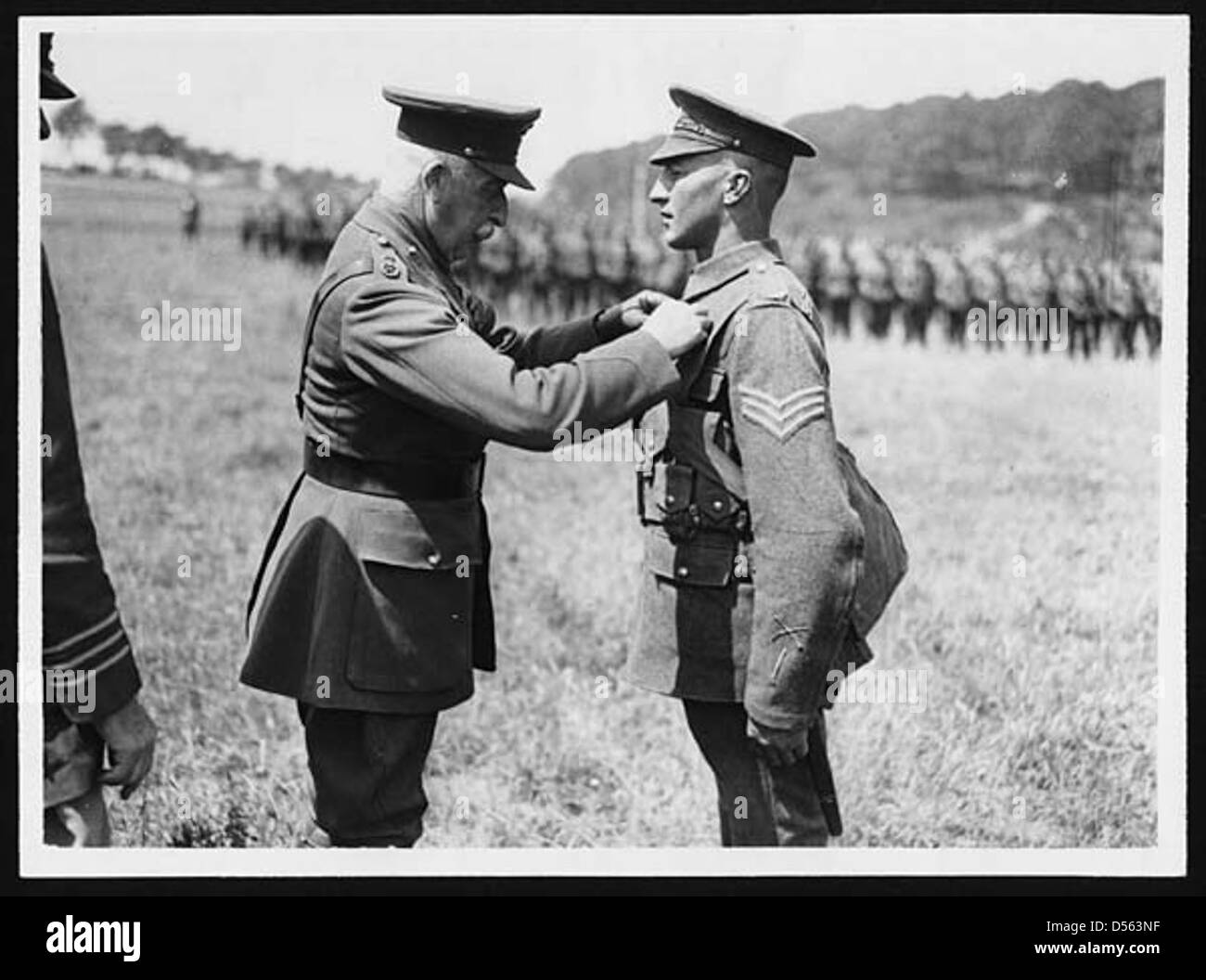 A ceremony where troops are decorated during World War I, recognizing ...